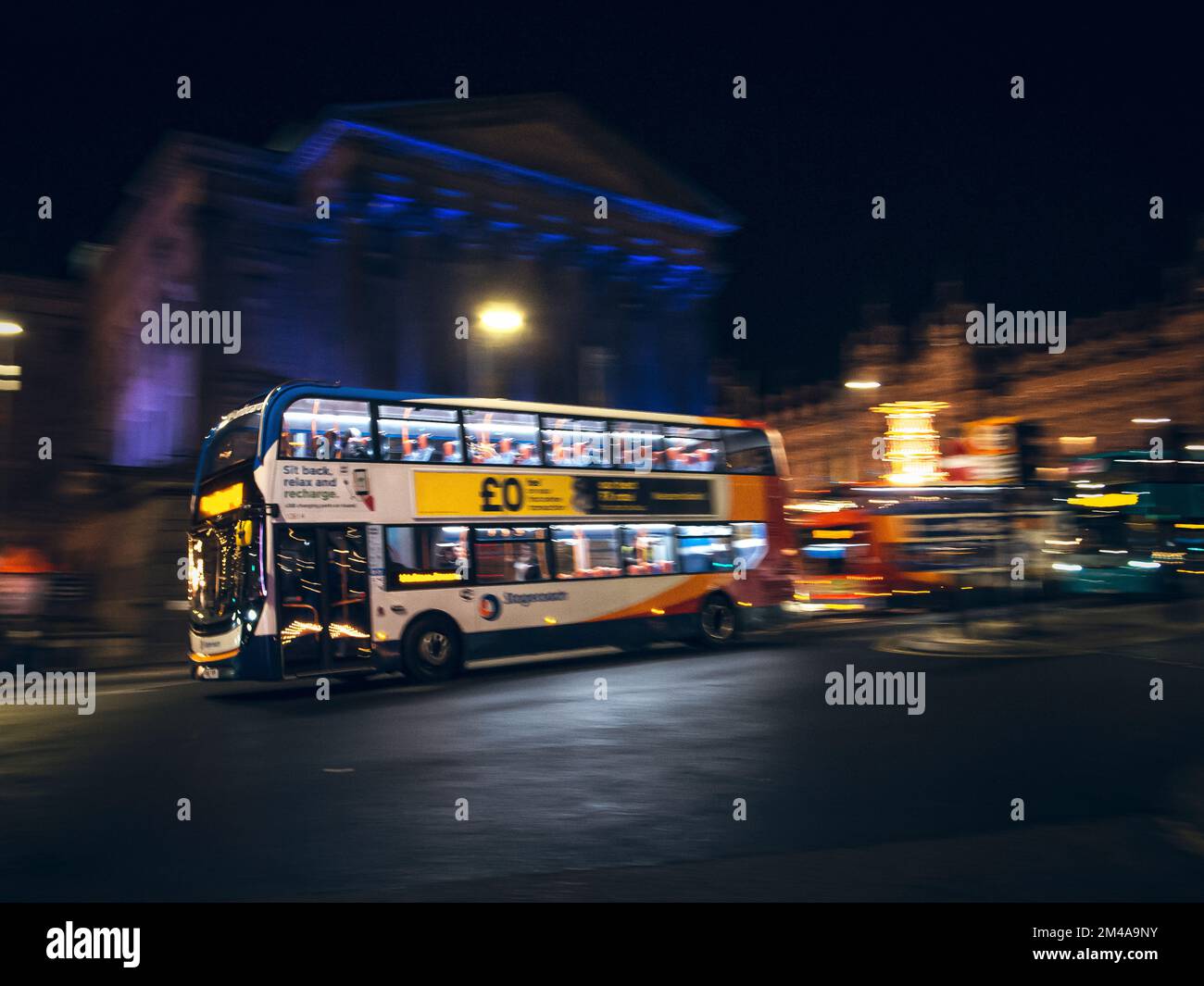 Buses moving at night in Liverpool Stock Photo - Alamy