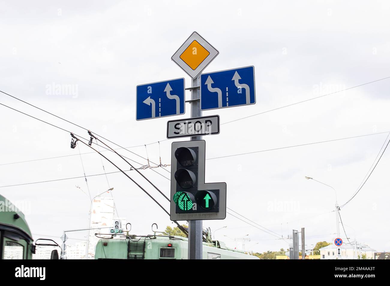 Green traffic light and road sign with arrows close up Stock Photo - Alamy