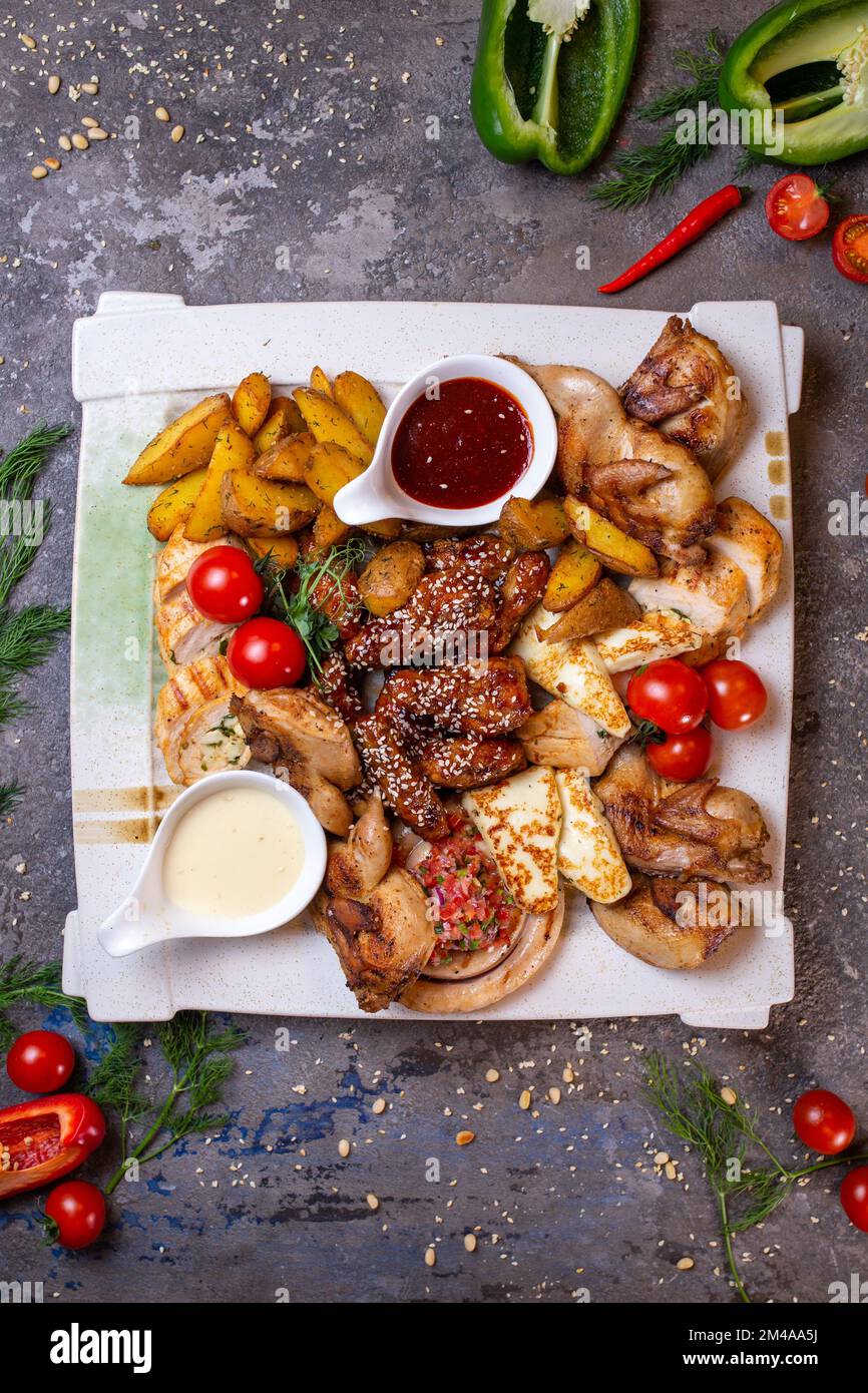 top view meat chicken platter, wings, baked chicken dish for company on ...