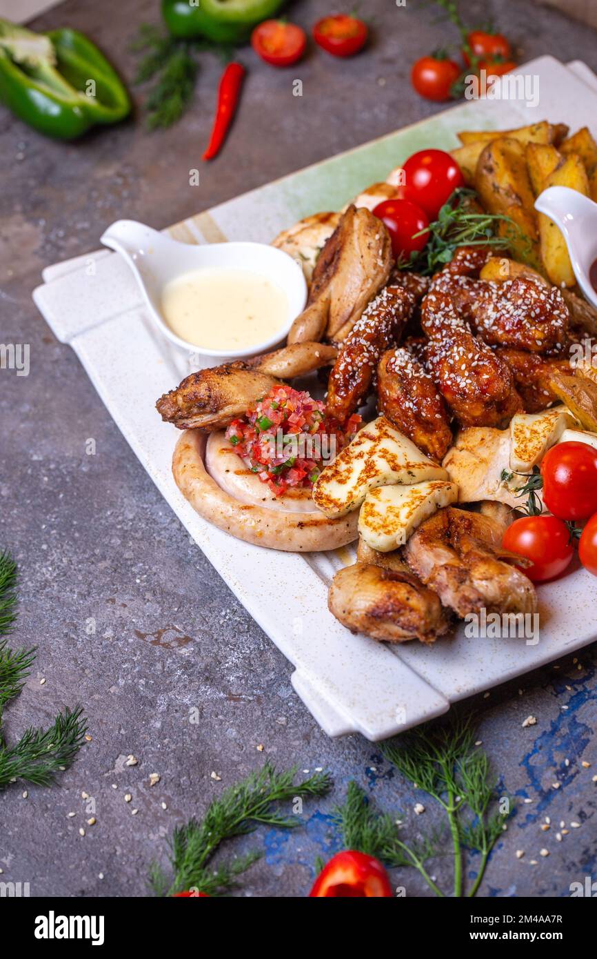 meat chicken platter, wings, baked chicken dish for the company Stock ...