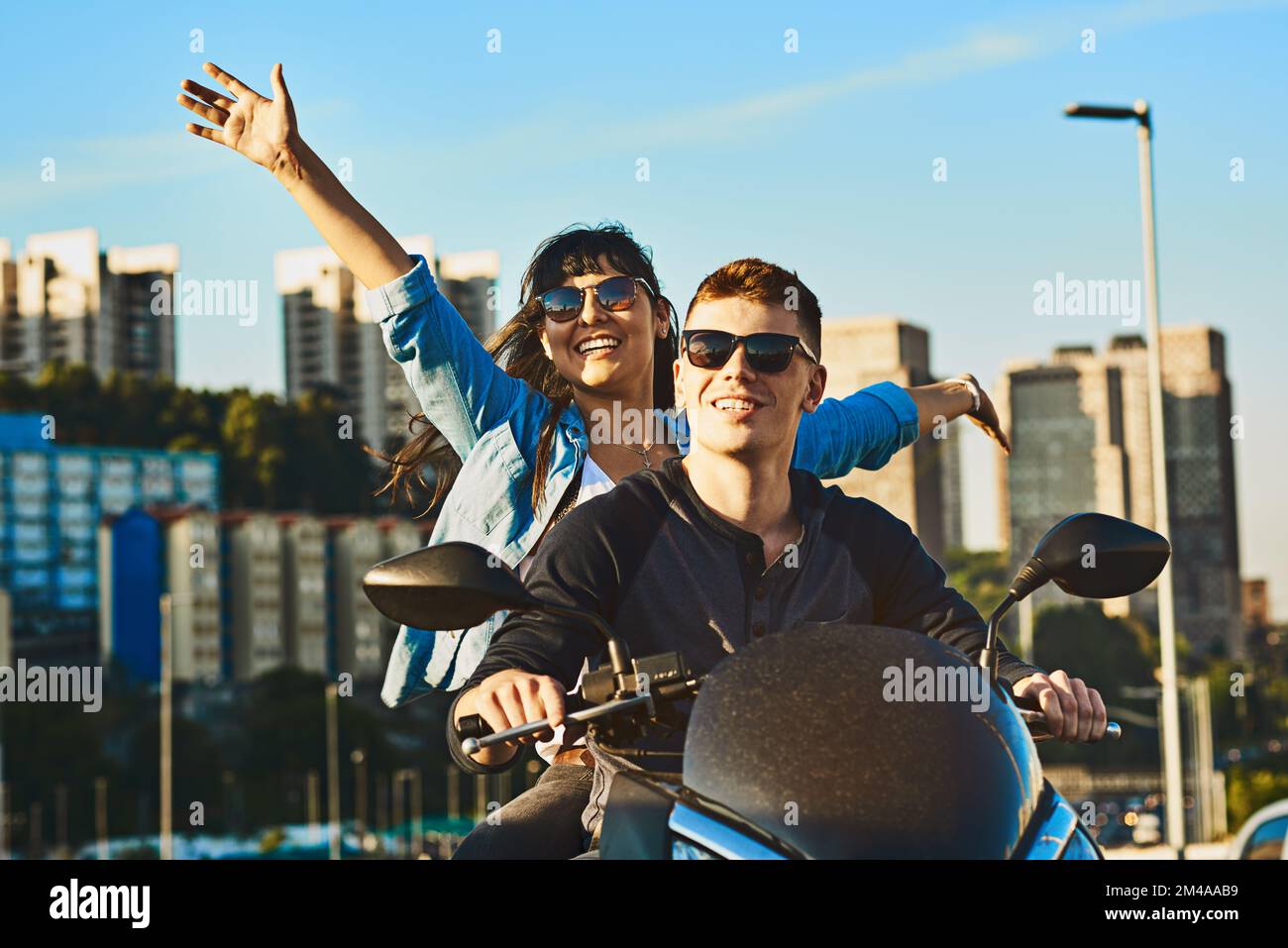 Commuting is easier and more fun this way. a young couple out for a ...