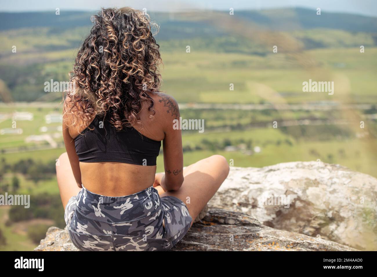 Calm woman curly hair sitting hi-res stock photography and images - Alamy