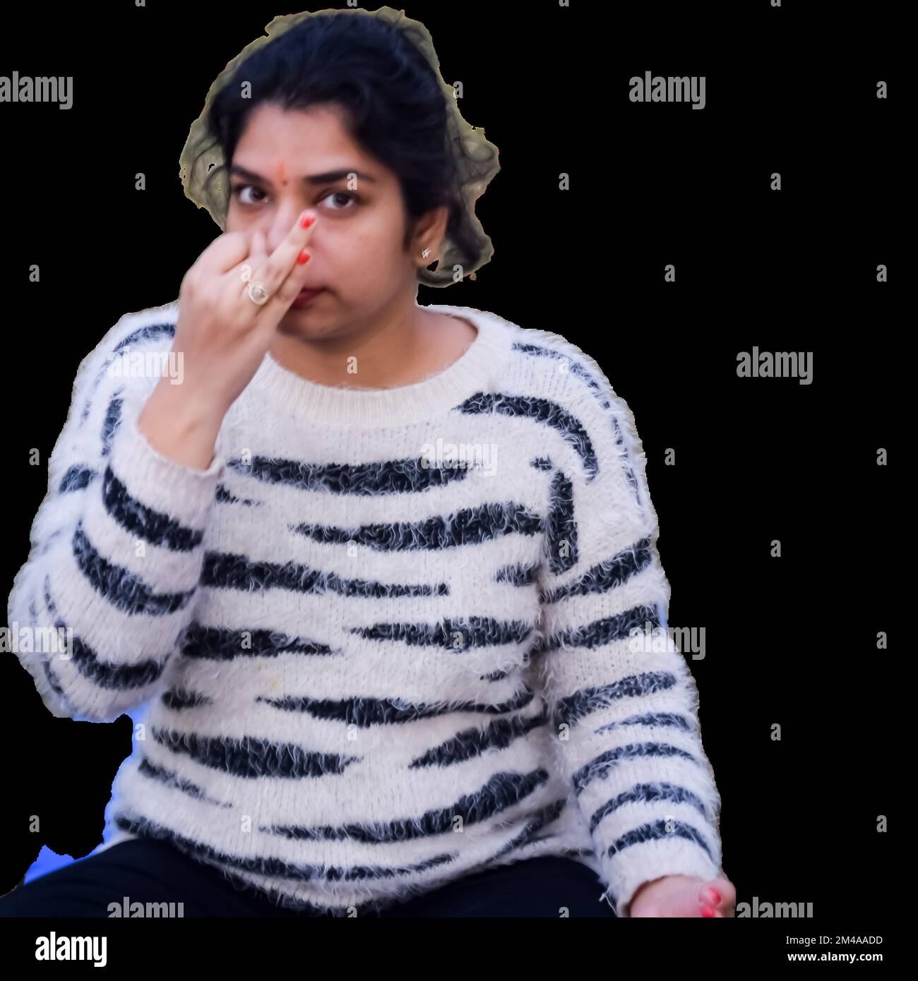 Portrait of gorgeous young Indian woman practicing yoga with plain ...