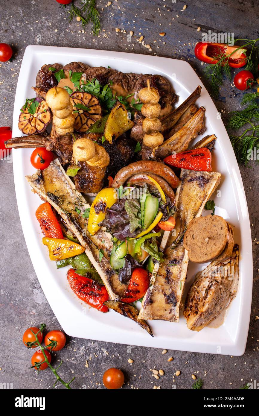 A set of different beef meat dishes on a white plate Stock Photo - Alamy
