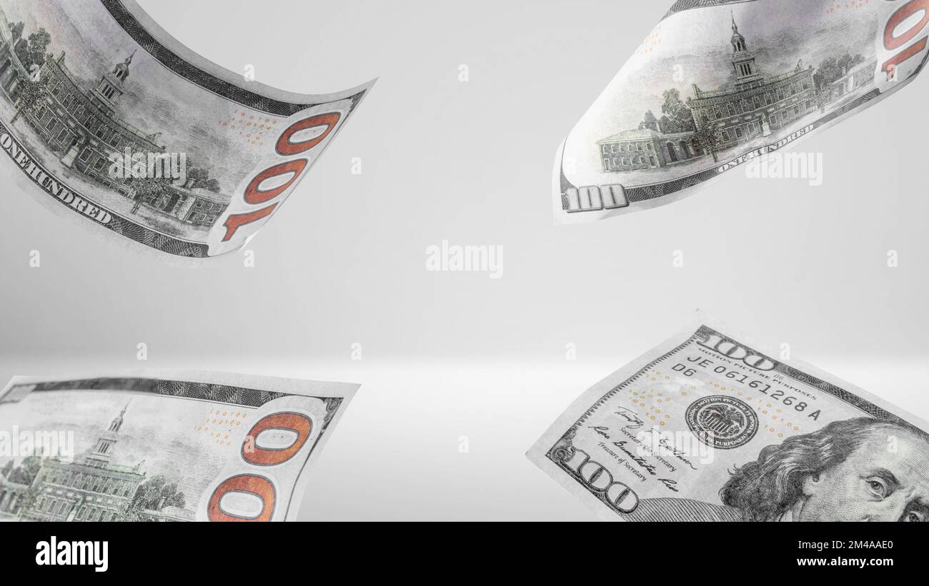 Flying dollars on gray background Stock Photo - Alamy