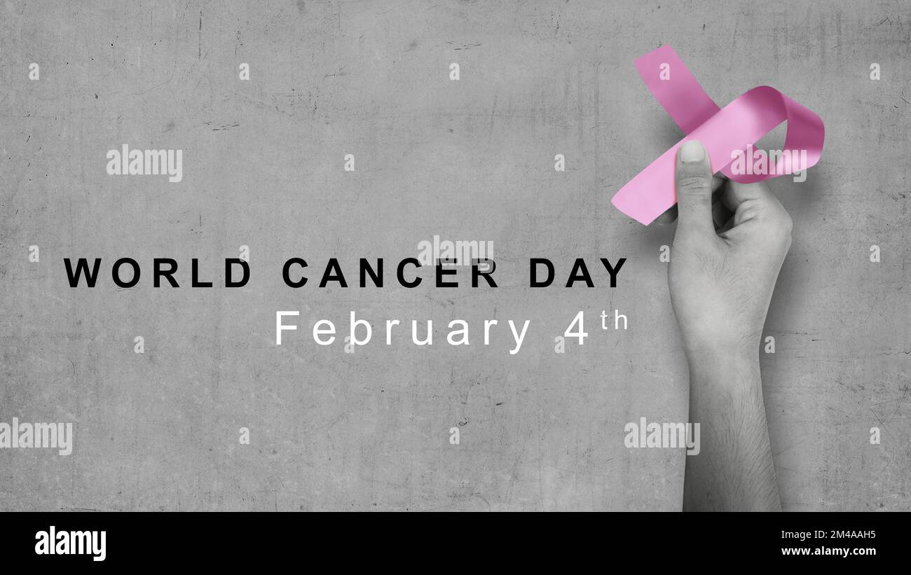 Human hand holding purple ribbons with a black background. World Cancer ...