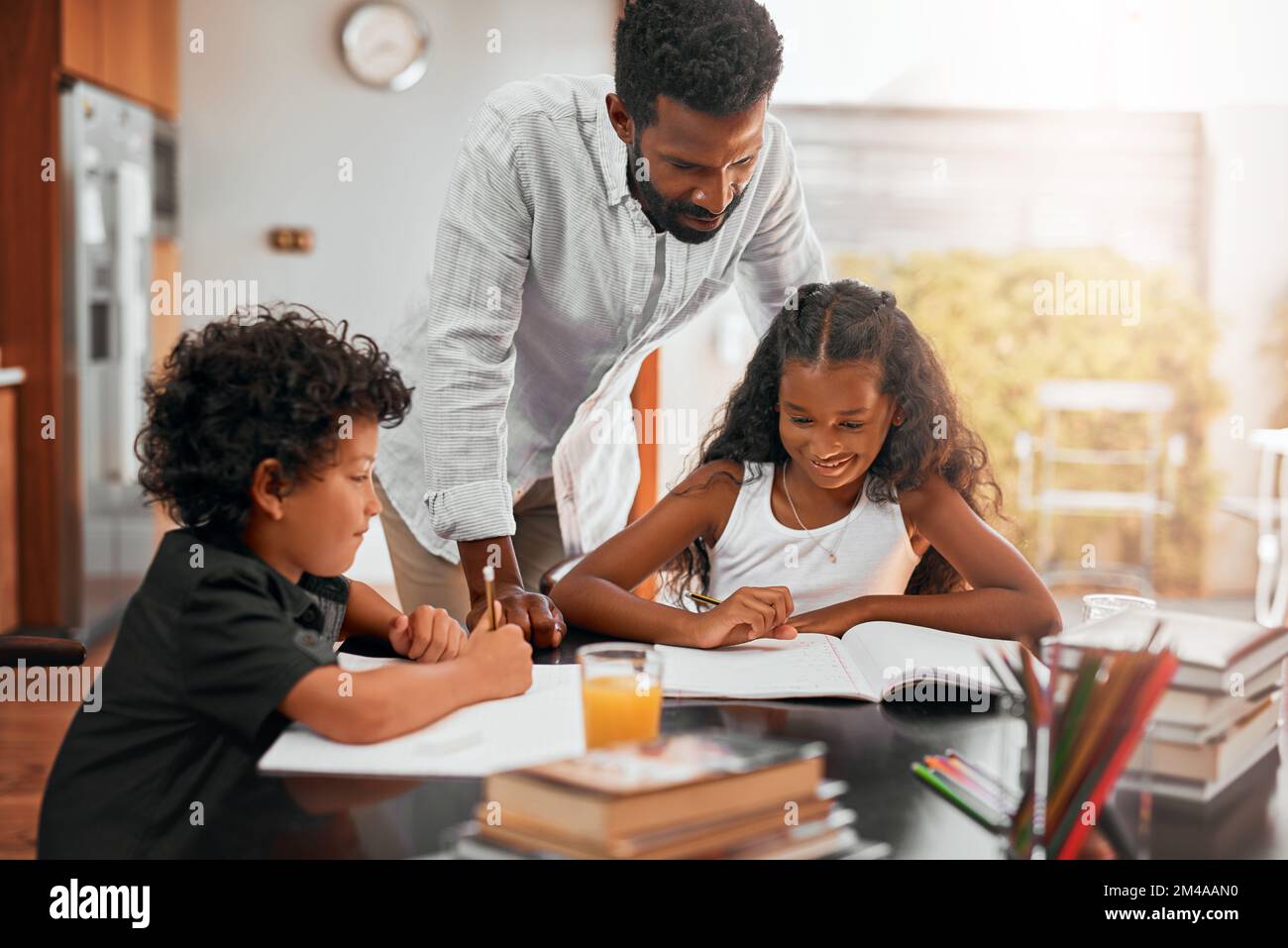 Provide guidance, but not answers. a dad helping his children with ...