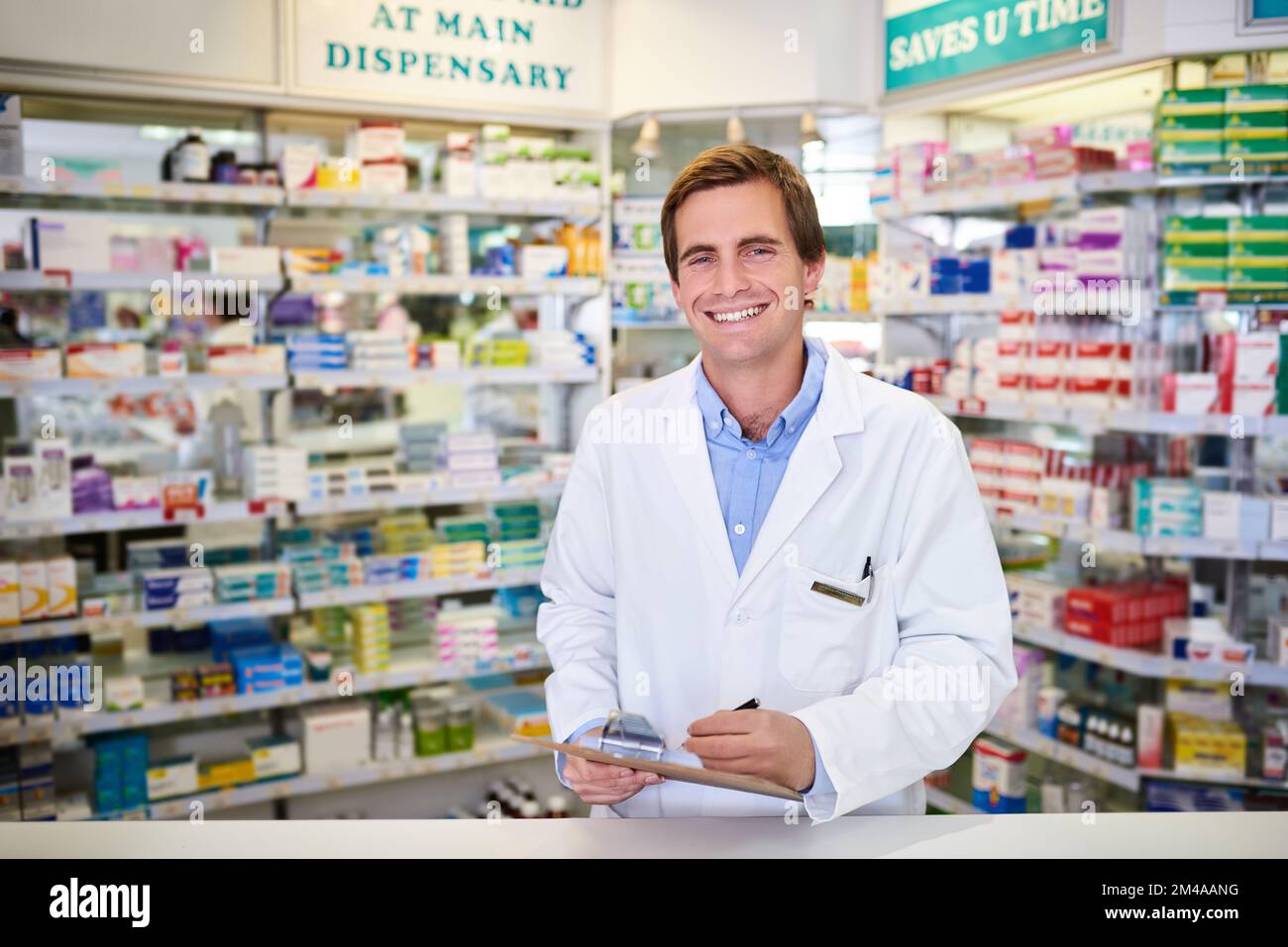 Our shelves are always stocked with all you need. Portrait of a young ...