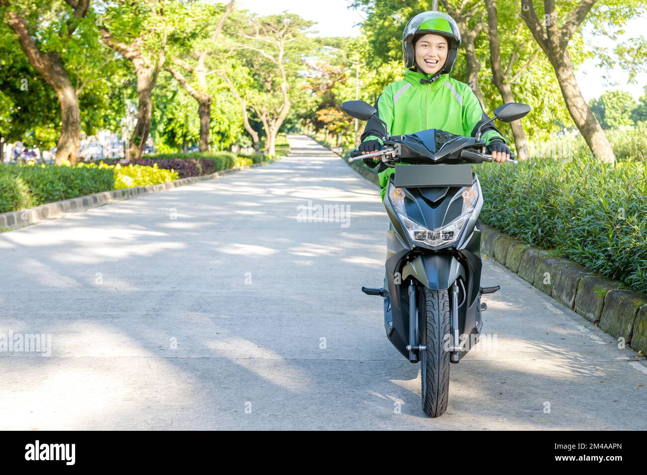 Asian woman works as a motorcycle taxi driver on the street Stock Photo ...