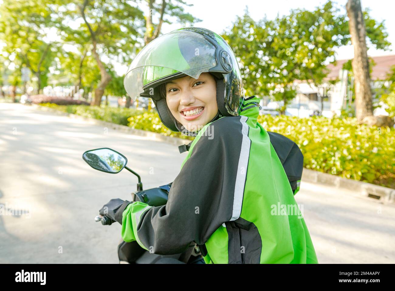 Asian woman works as a motorcycle taxi driver on the street Stock Photo ...