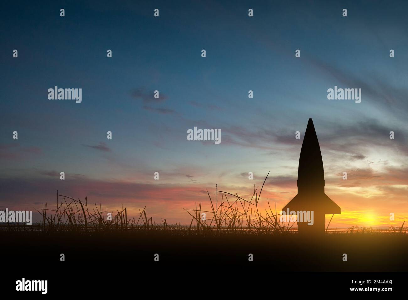 Silhouette of rockets on the field with a sunset sky background ...