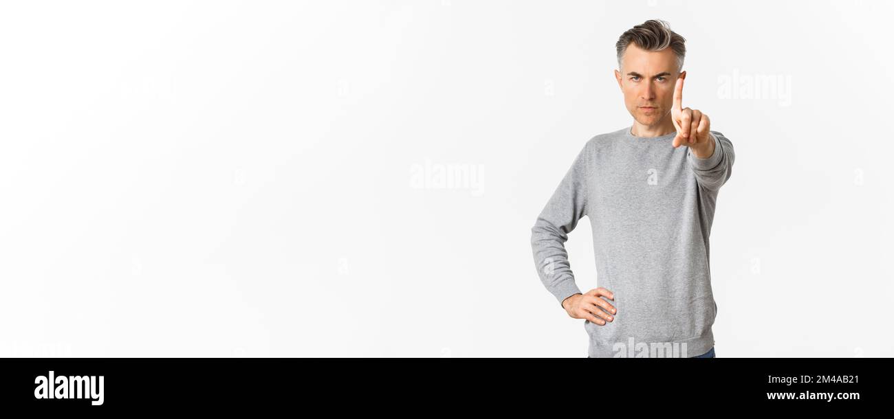 Image of serious-looking and confident middle-aged man telling no ...