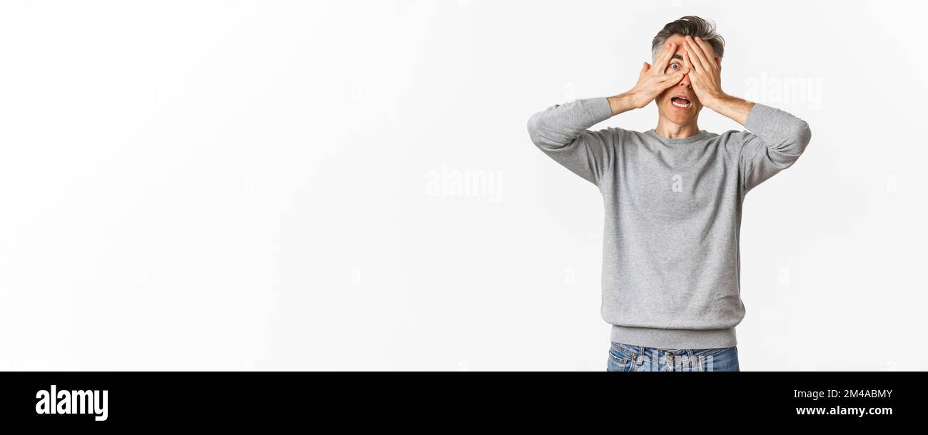 Image of embarrassed of scared middle-aged man cover his eyes with ...