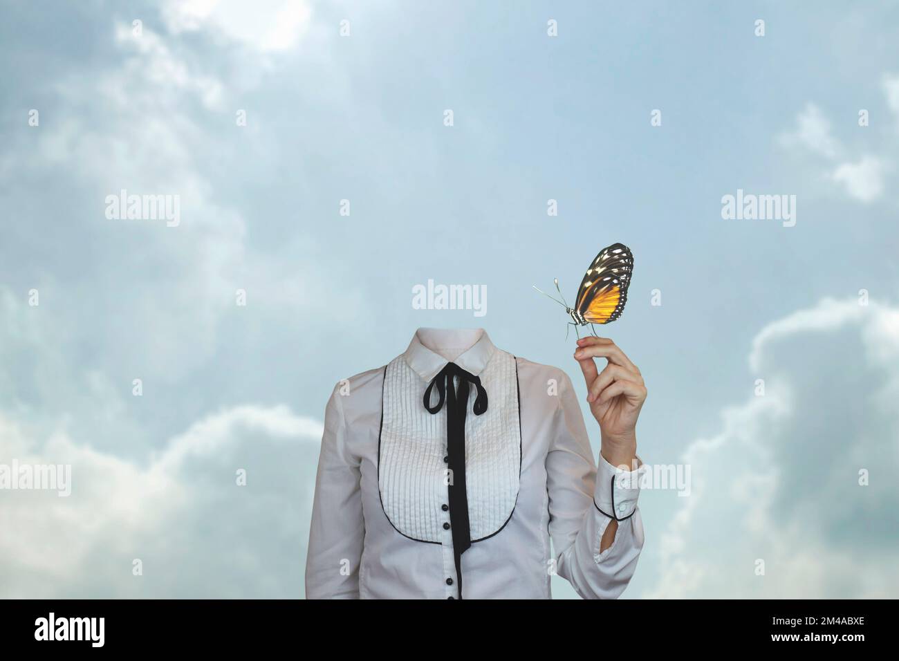 surreal headless woman with a butterfly leaning on her hand, concept of ...