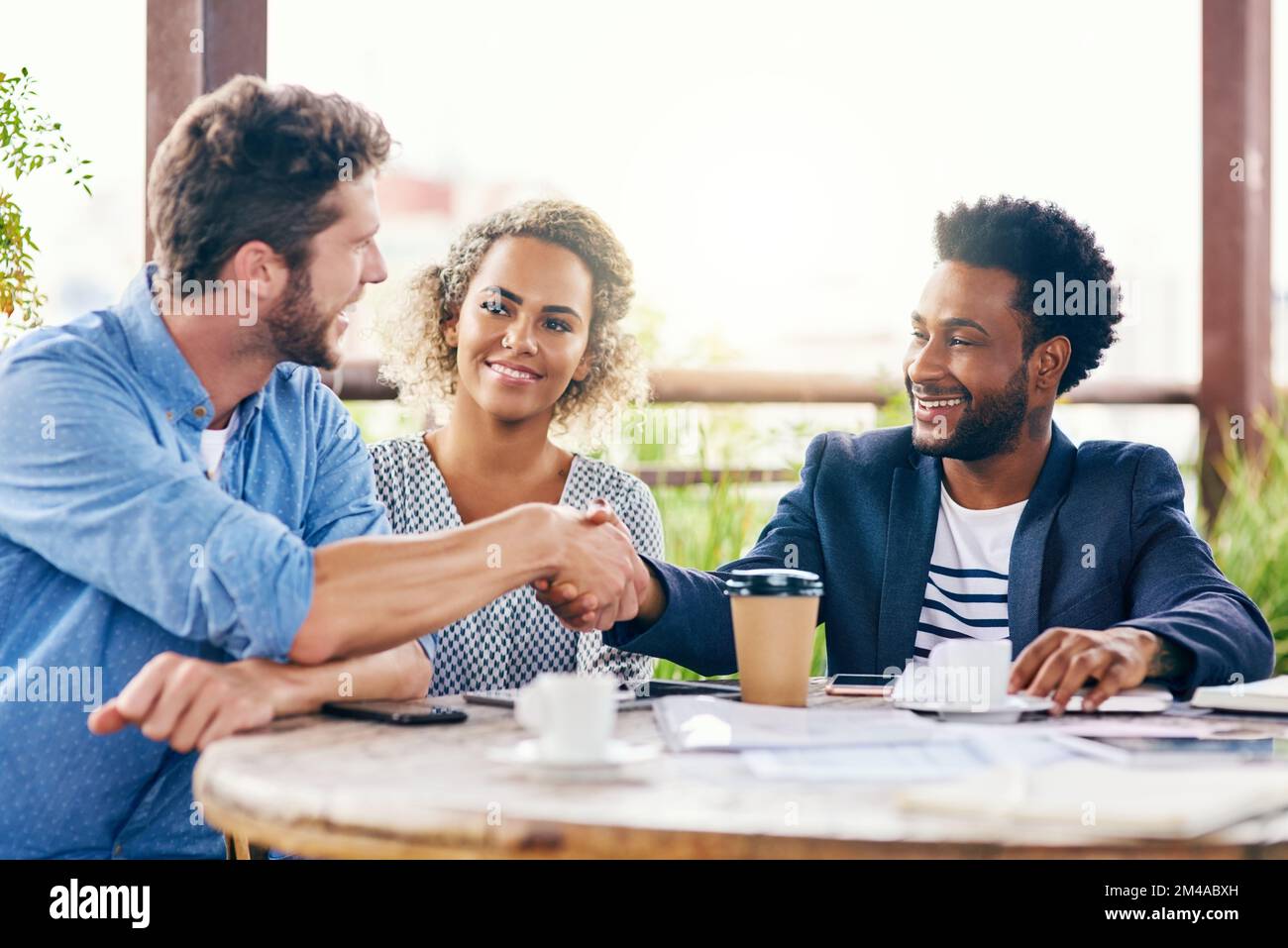 Building a solid network toward success. businesspeople shaking hands ...