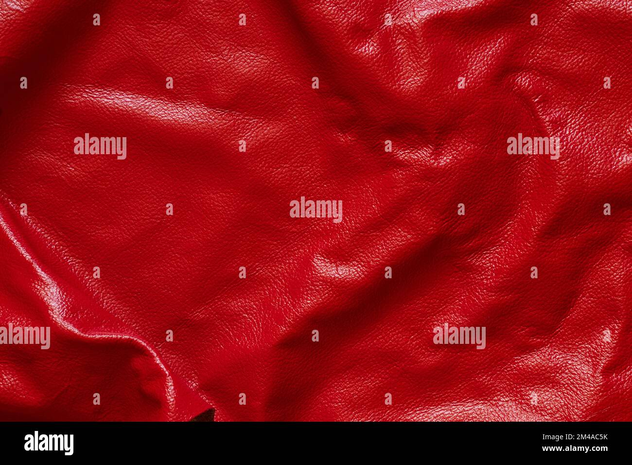 dark red genuine leather as a close up background Stock Photo - Alamy