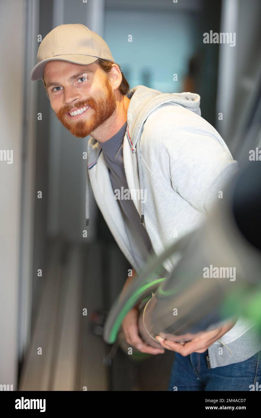 construction worker on site holding pipe Stock Photo - Alamy