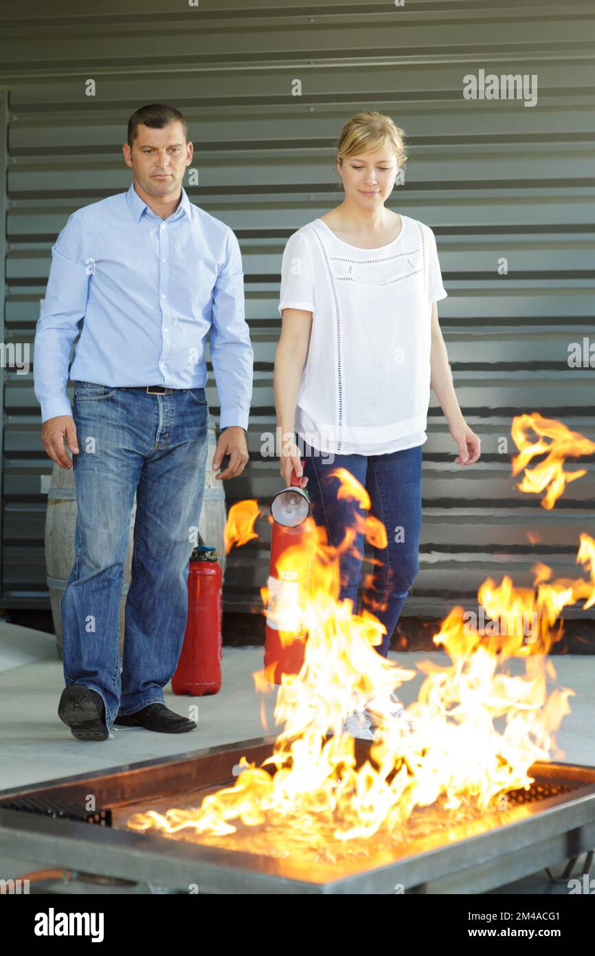 people during fire extinguishing exercise Stock Photo - Alamy