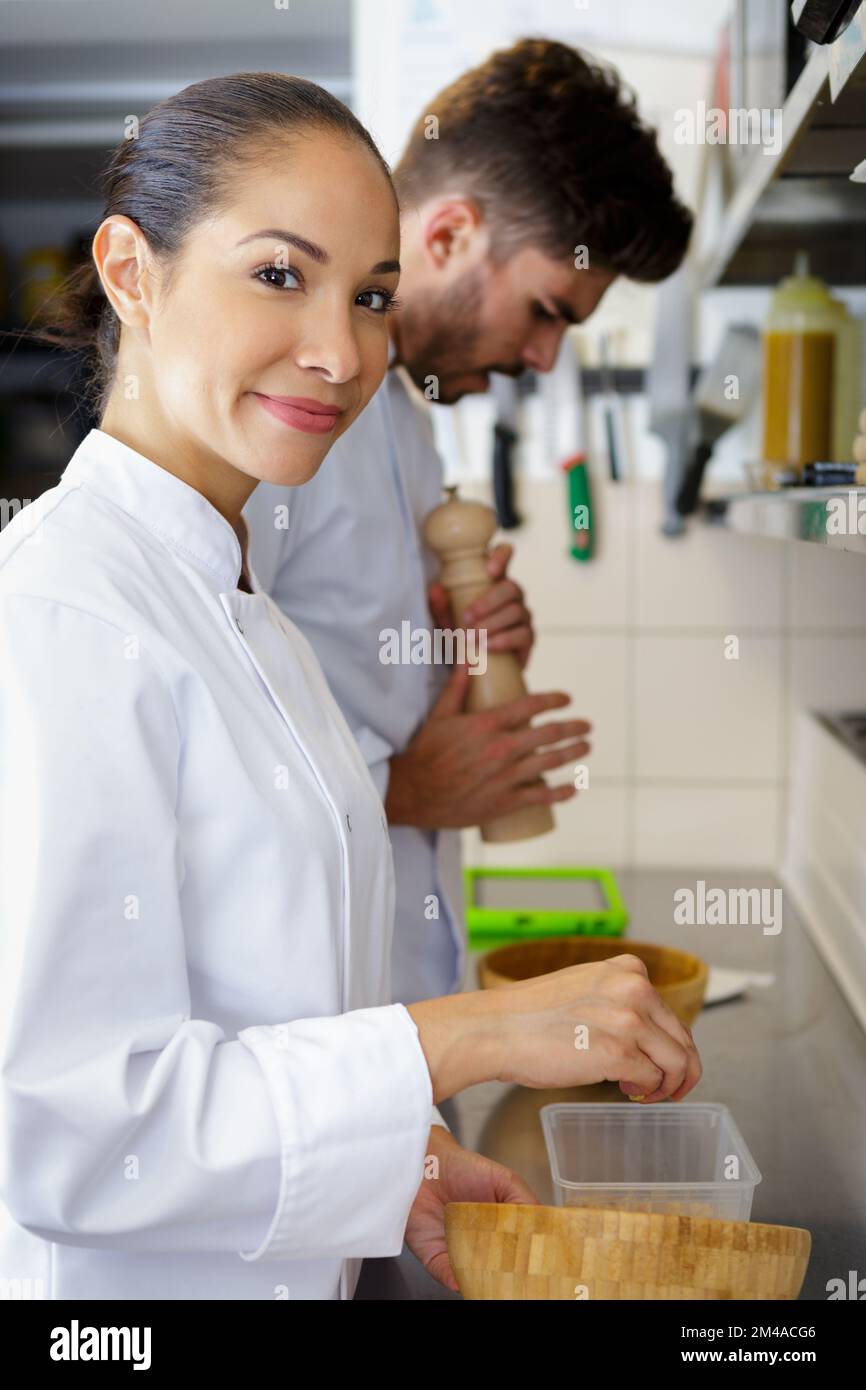professional chefs prepare dish at restaurant Stock Photo - Alamy