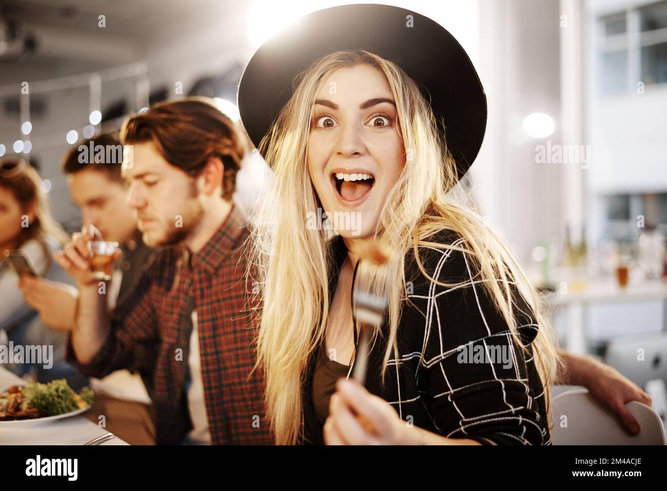 I love a good time. a young woman enjoying herself at a get together ...