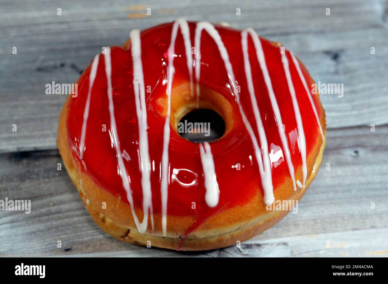 Strawberry flavor ring donut with white chocolate sauce, glazed, yeast ...