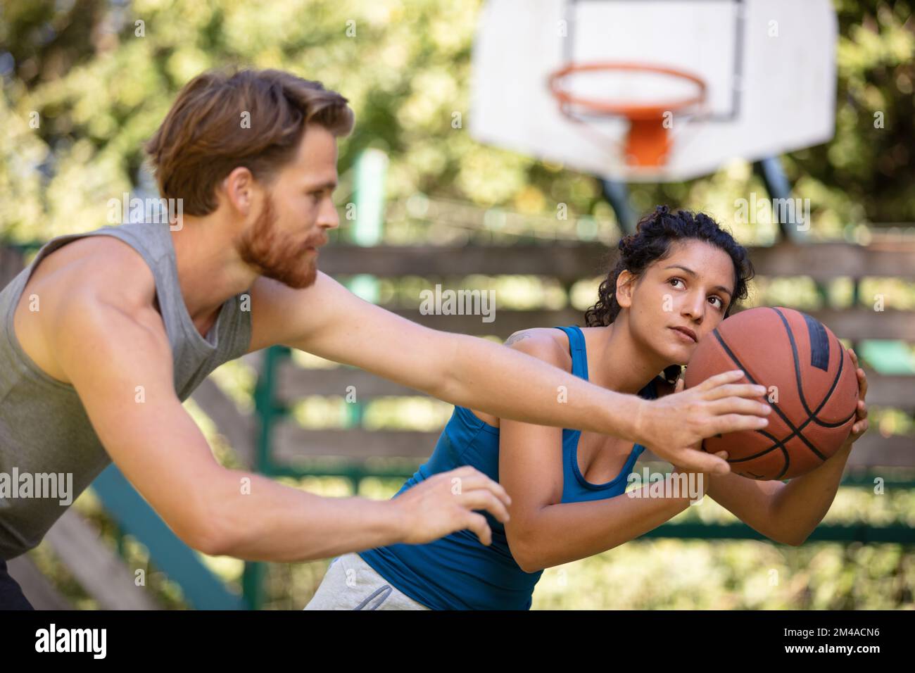 Outdoor basketball court players sun hi-res stock photography and ...