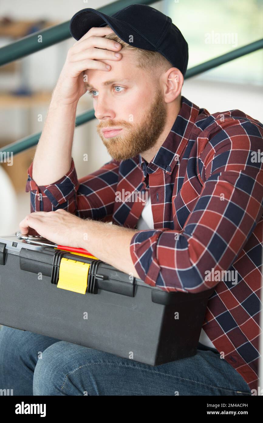 Young sad construction engineer hi-res stock photography and images - Alamy