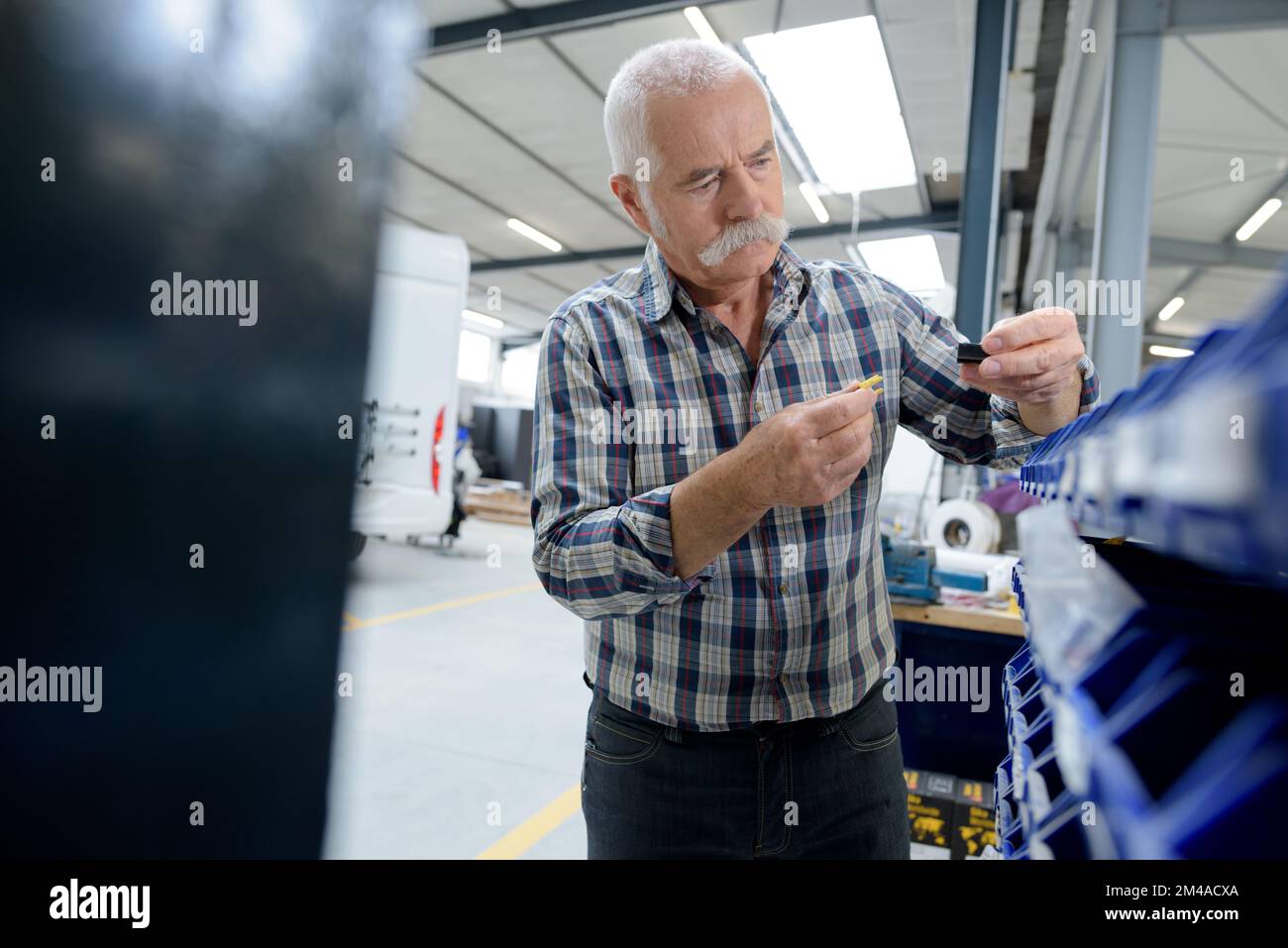portrait of senior factory worker in industrial workshop Stock Photo ...