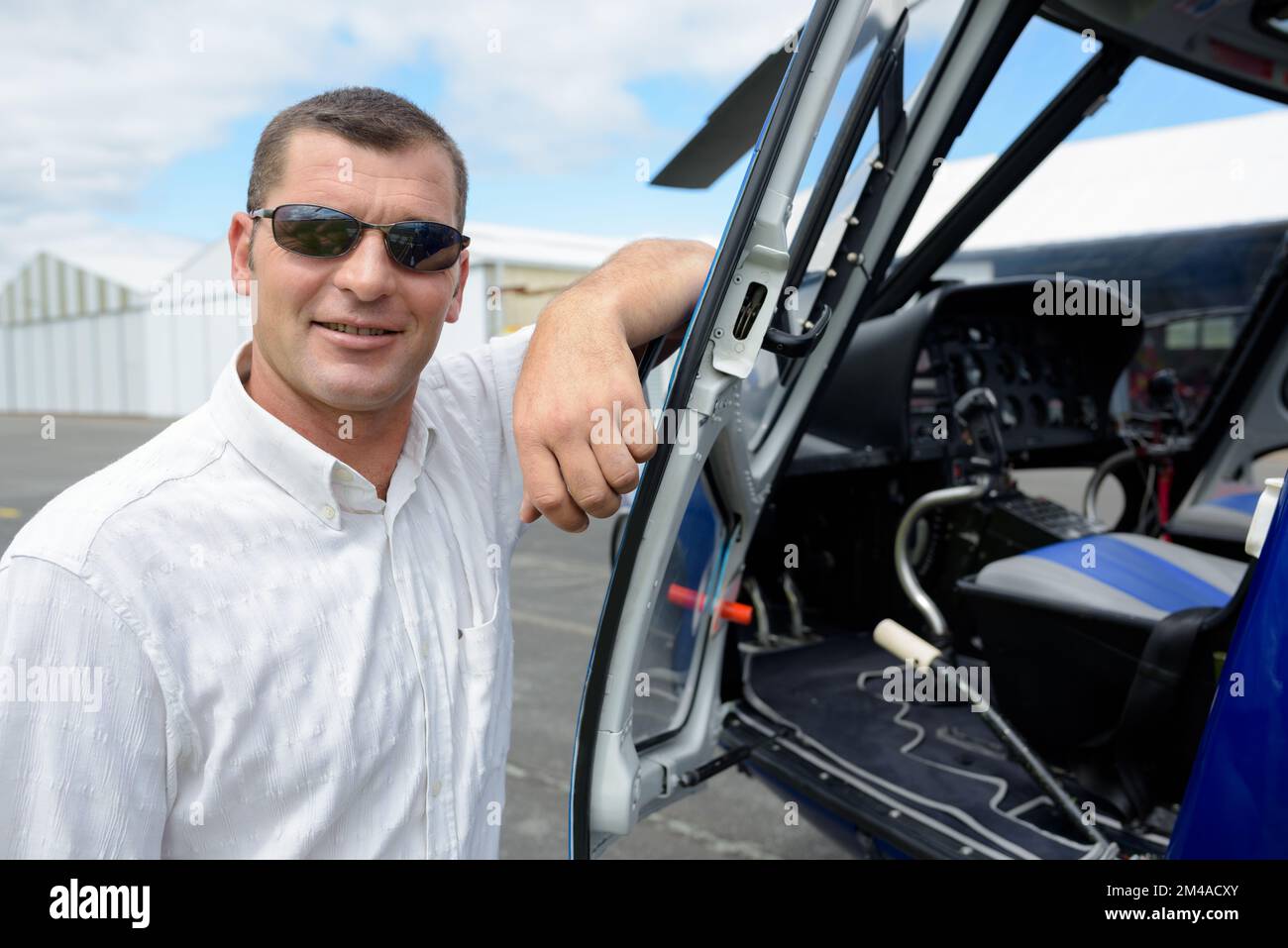 pilot and co pilot in cockpit of helicopter Stock Photo - Alamy