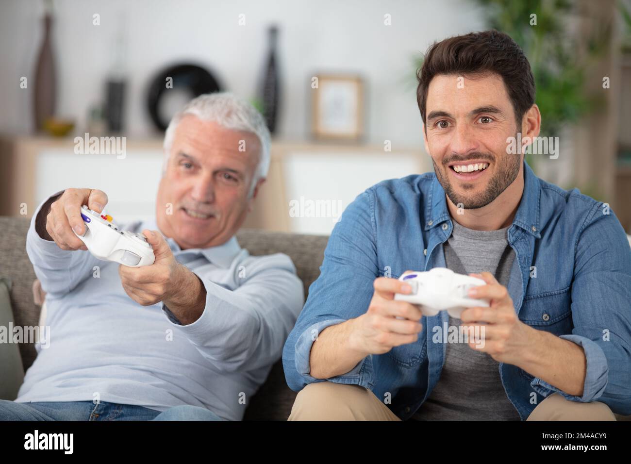 Two men playing paddle hi-res stock photography and images - Alamy