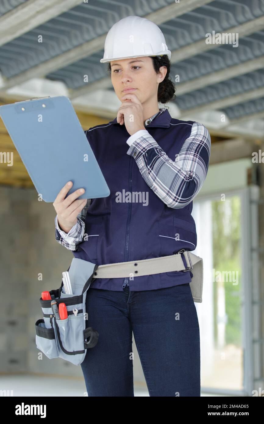 young technician carrying out inspection at construction site Stock ...