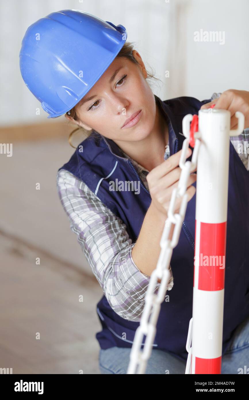 portrait of a female builder during works Stock Photo - Alamy