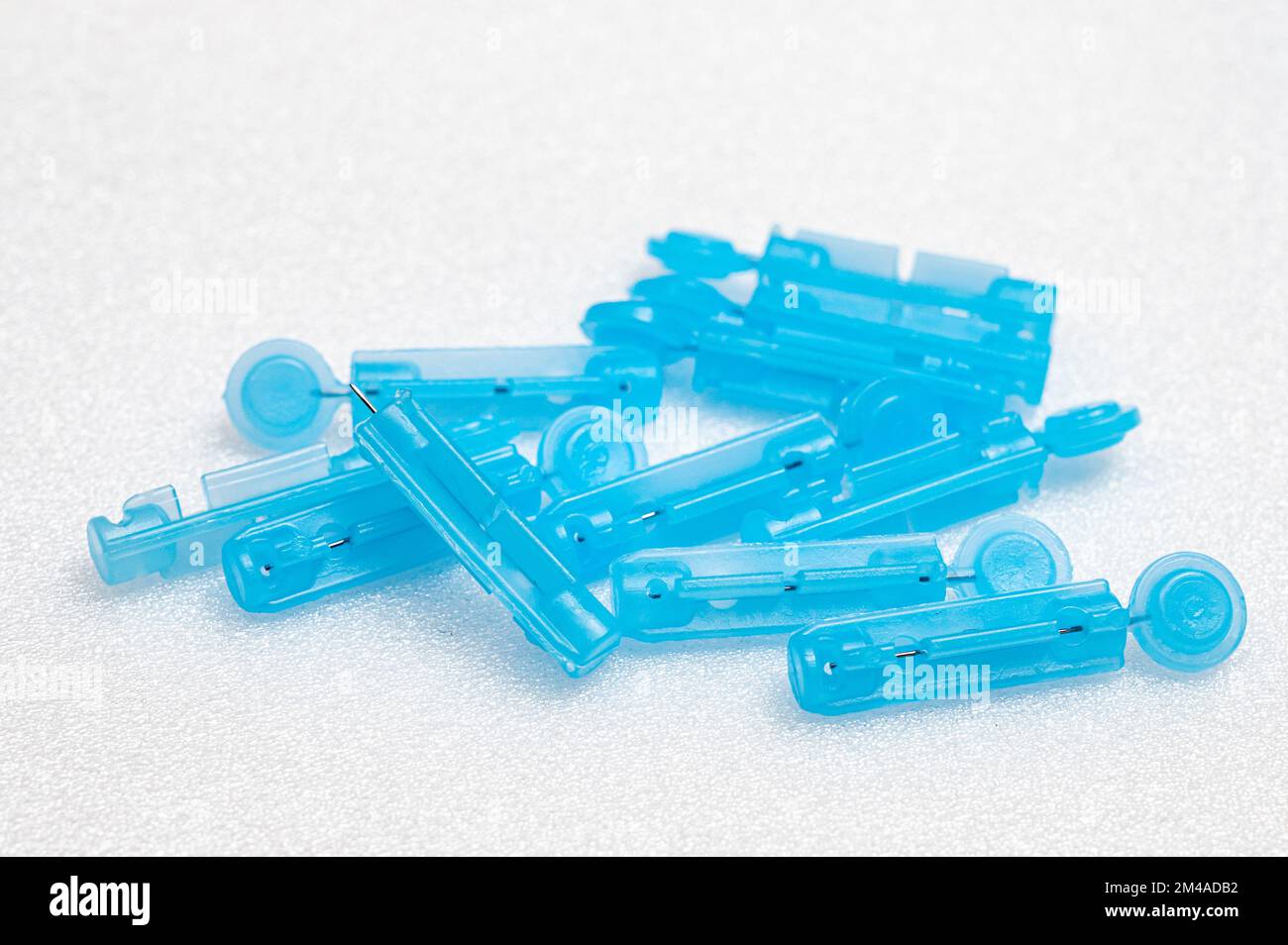 Lancets for pen on white background. Diabetes concept Stock Photo - Alamy