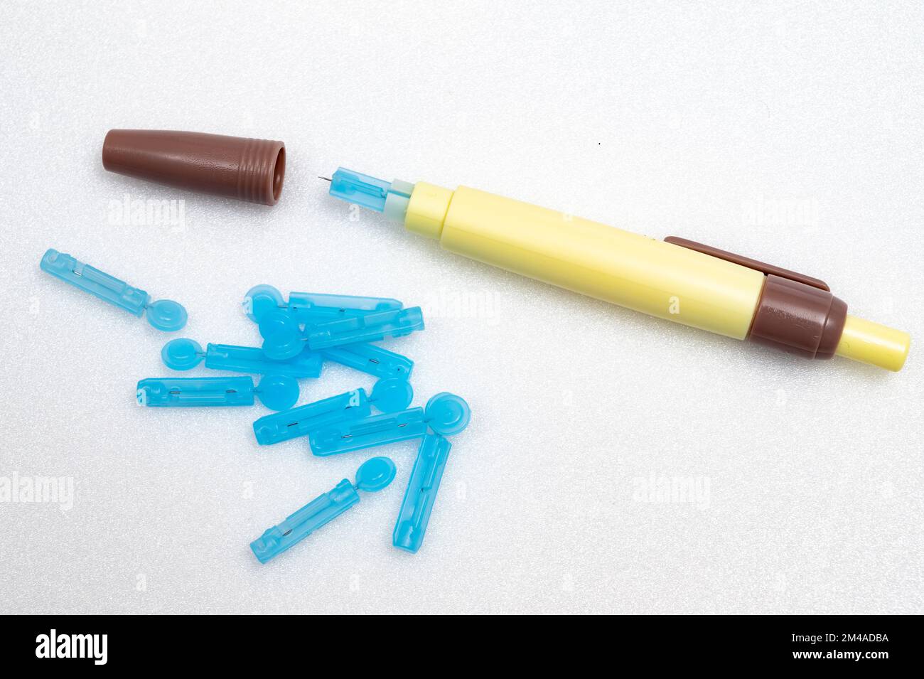 Lancets for pen on white background. Diabetes concept Stock Photo - Alamy