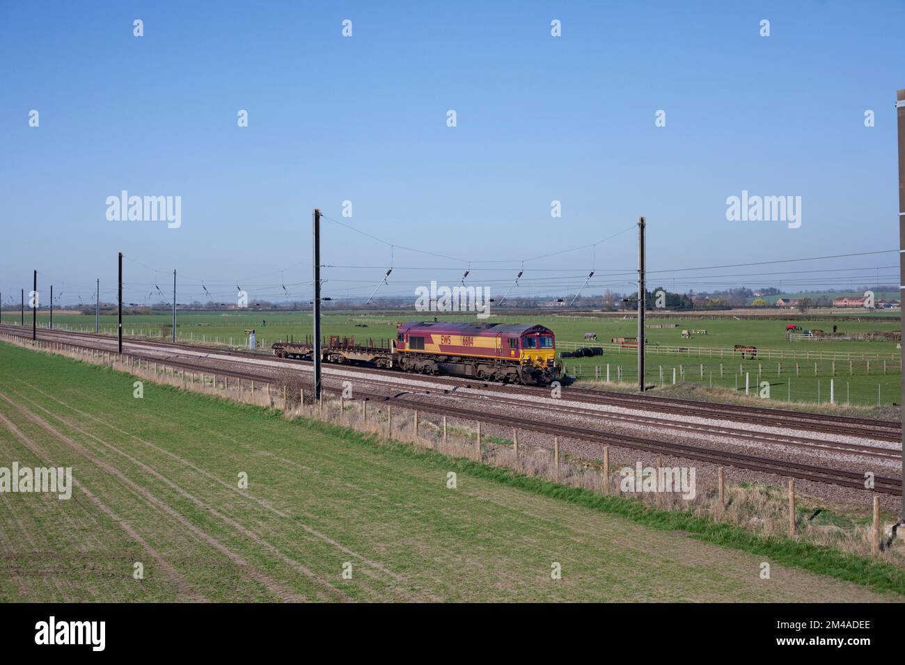 DB Cargo rail class 66 locomotive 66114 in EWS colours hauling a short ...