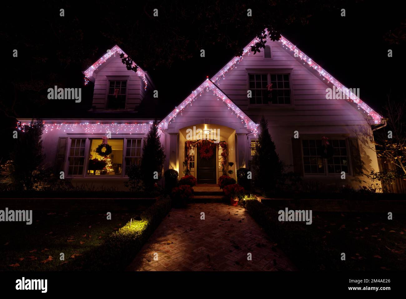 Christmas Night Lights Decorating A House Stock Photo - Alamy