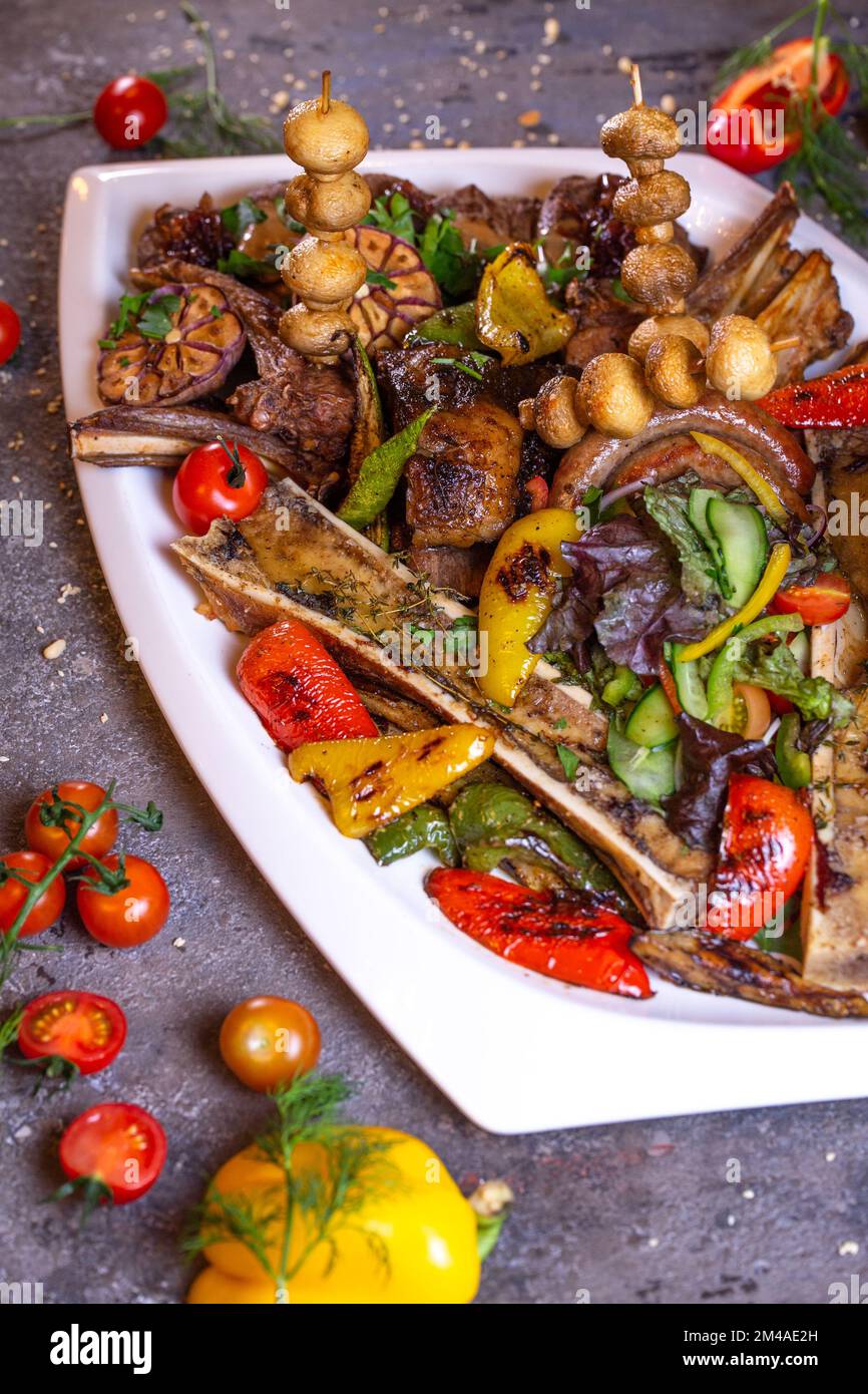 A set of different beef meat dishes on a white plate Stock Photo - Alamy