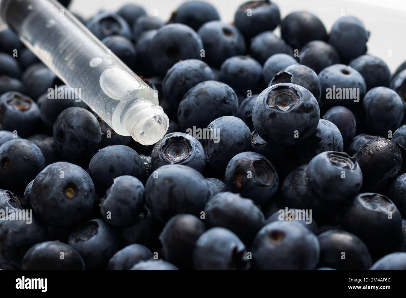 syringe and blueberry, biohazard liquid Stock Photo - Alamy