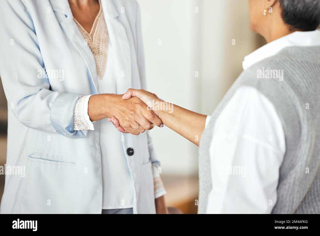 Partnership, handshake and business women in corporate workplace for ...