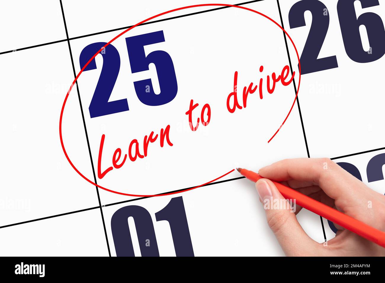 25th day of the month. Hand writing text LEARN TO DRIVE on calendar ...