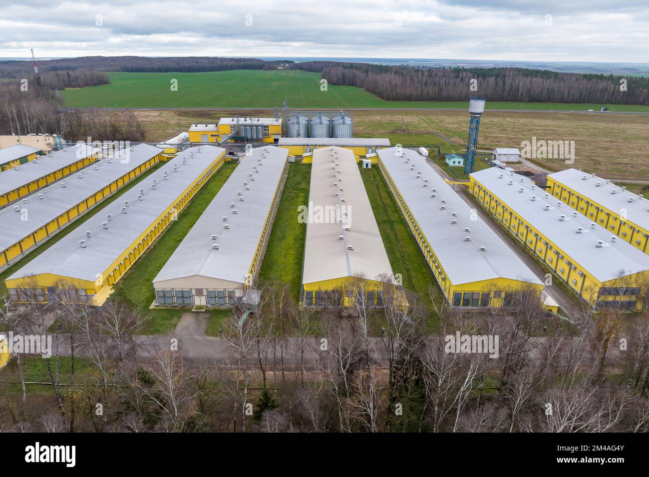 aerial view of rows of agro farms with silos and agro-industrial ...