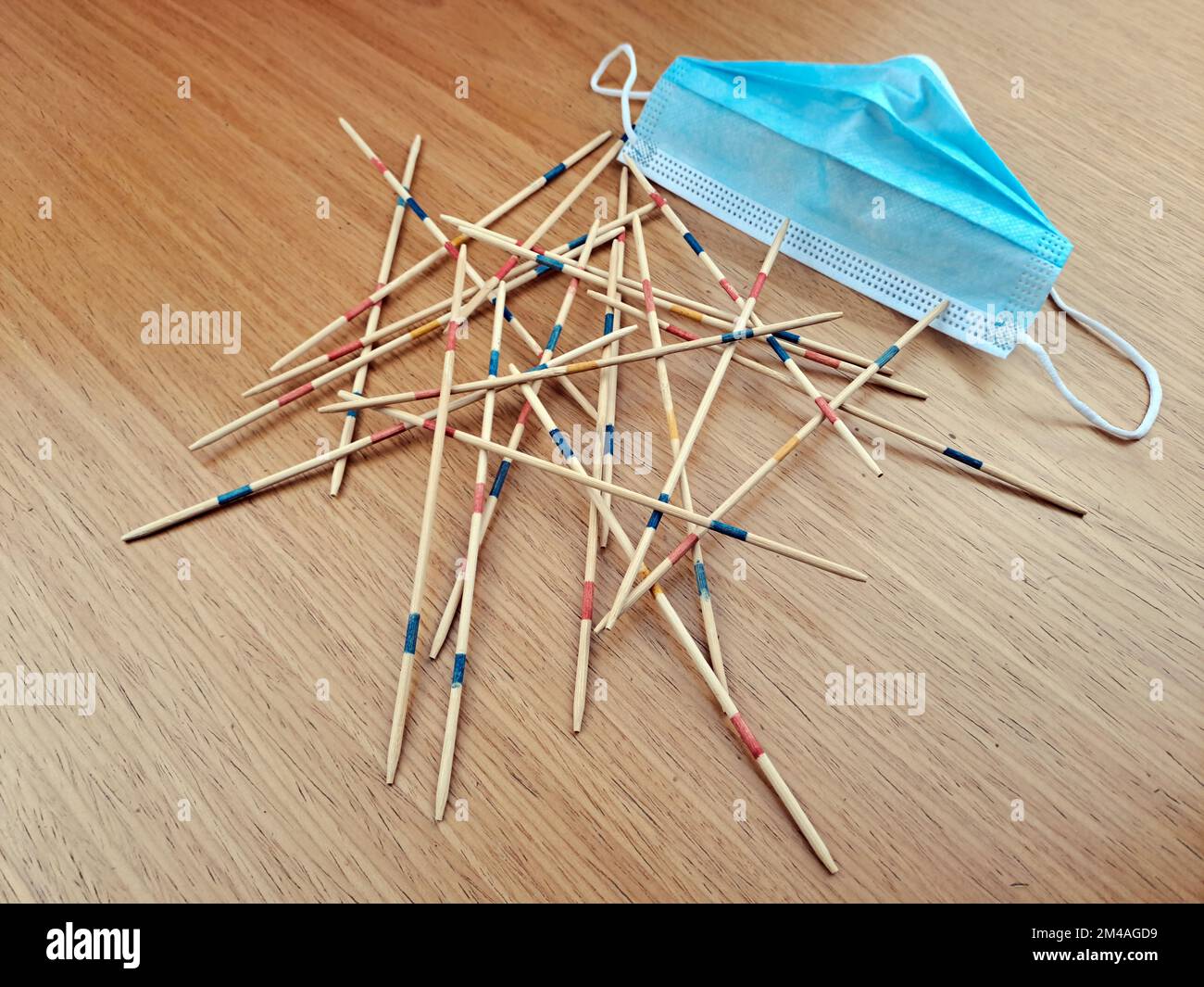 Mikado Board Game With Wooden SticksCovid time. Brown wooden table ...