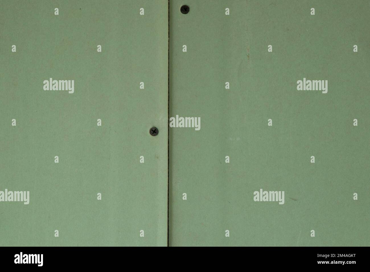 plasterboard green on the wall, room repair Stock Photo - Alamy