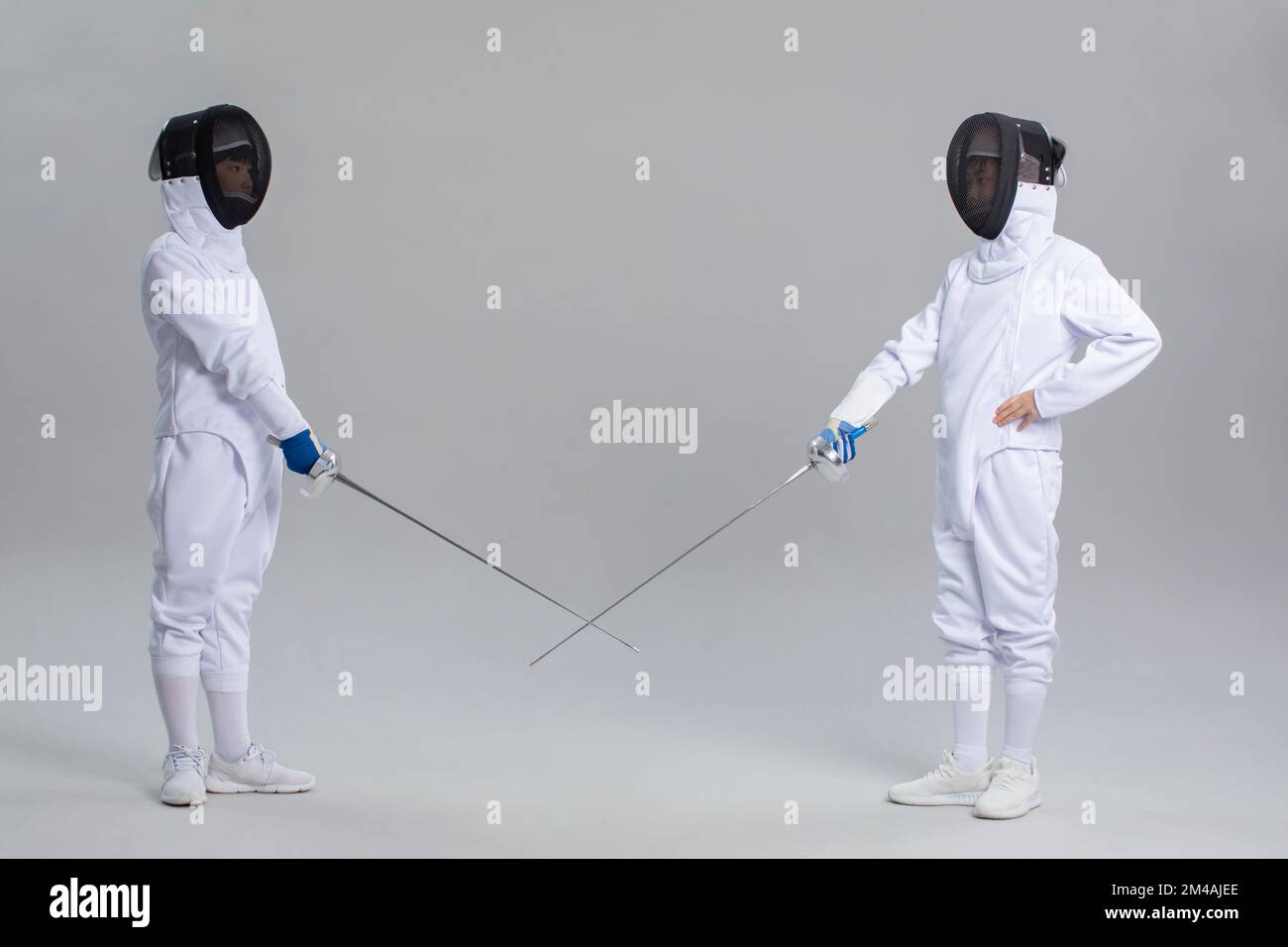 Cute Chinese boys in fencing suit Stock Photo - Alamy