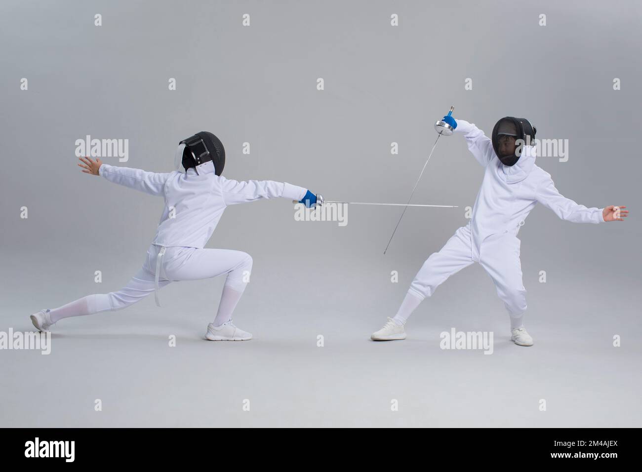 Cute Chinese boys in fencing suit Stock Photo - Alamy