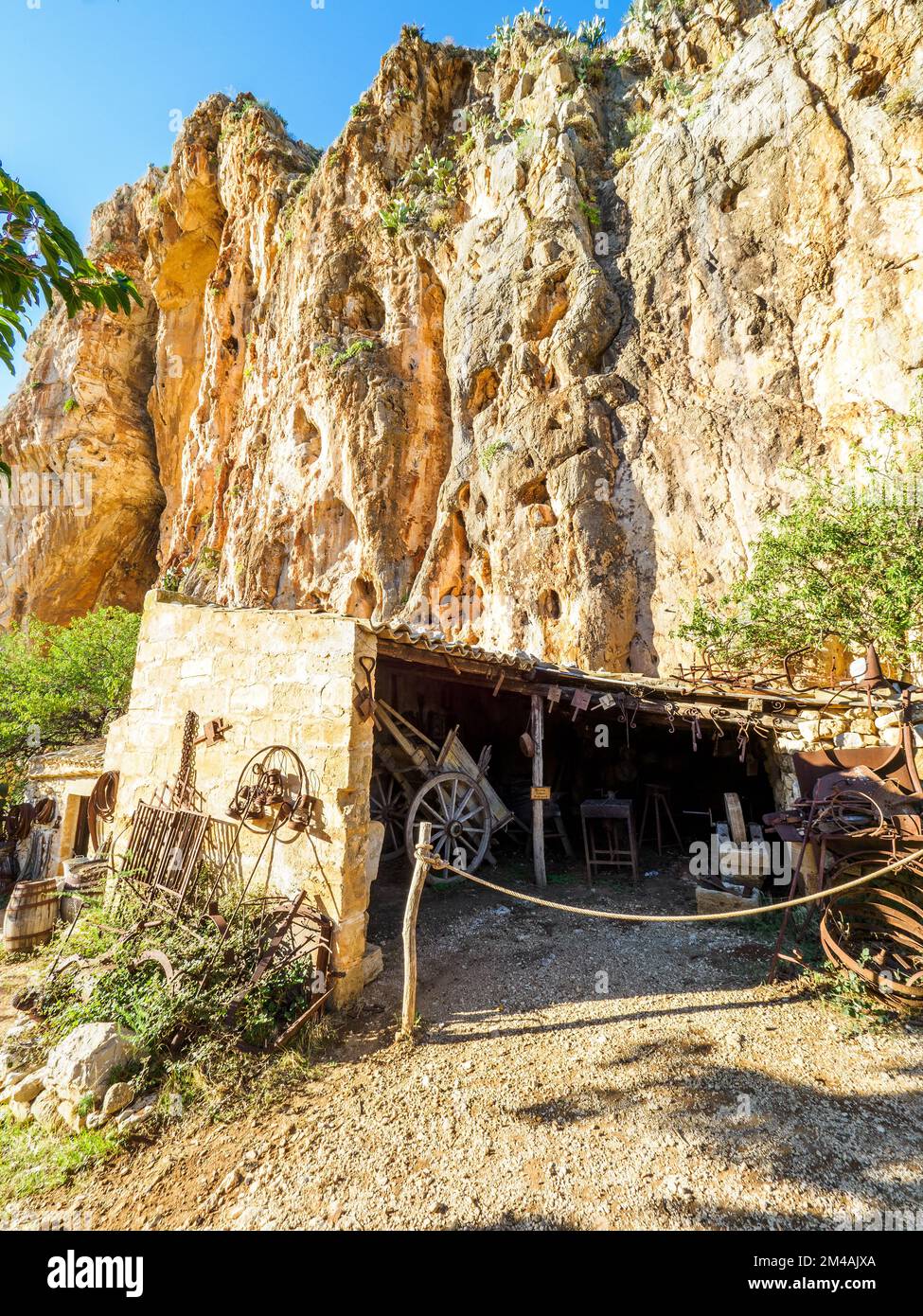 Open-air museum at the Scurati Caves or “Grotta Mangiapane” an ancient ...