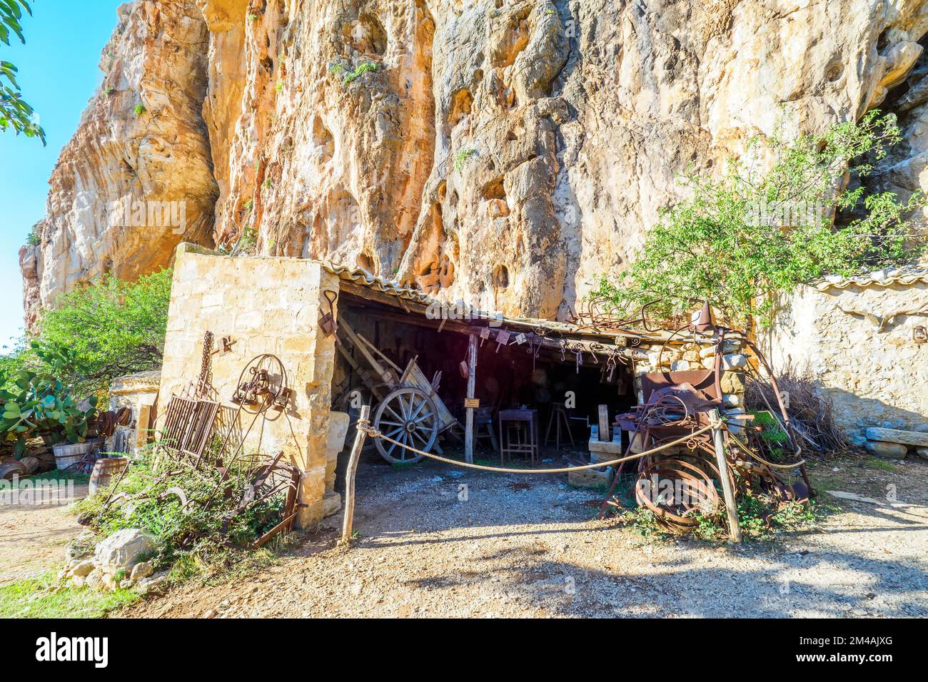 Open-air museum at the Scurati Caves or “Grotta Mangiapane” an ancient ...