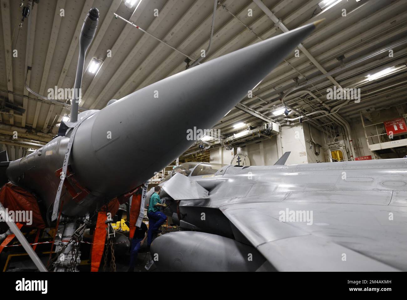 French navy aircraft technicians work on French air force Rafale ...