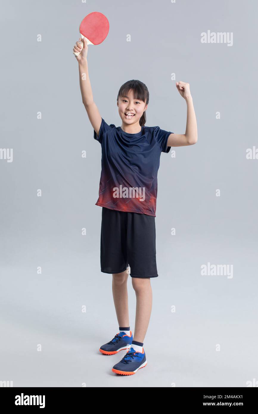 Cute girl playing table tennis hi-res stock photography and images - Alamy