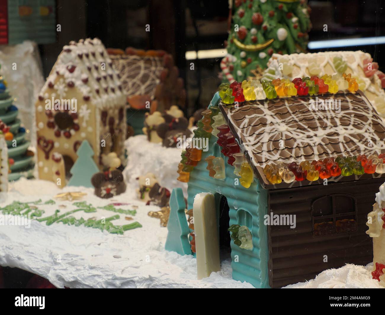 Christmas Gingerbread and chocolate House decorated with candy canes ...